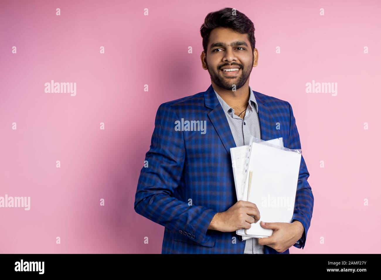 Indoor shot of pleased successful man, financier, manager, dressed in ...