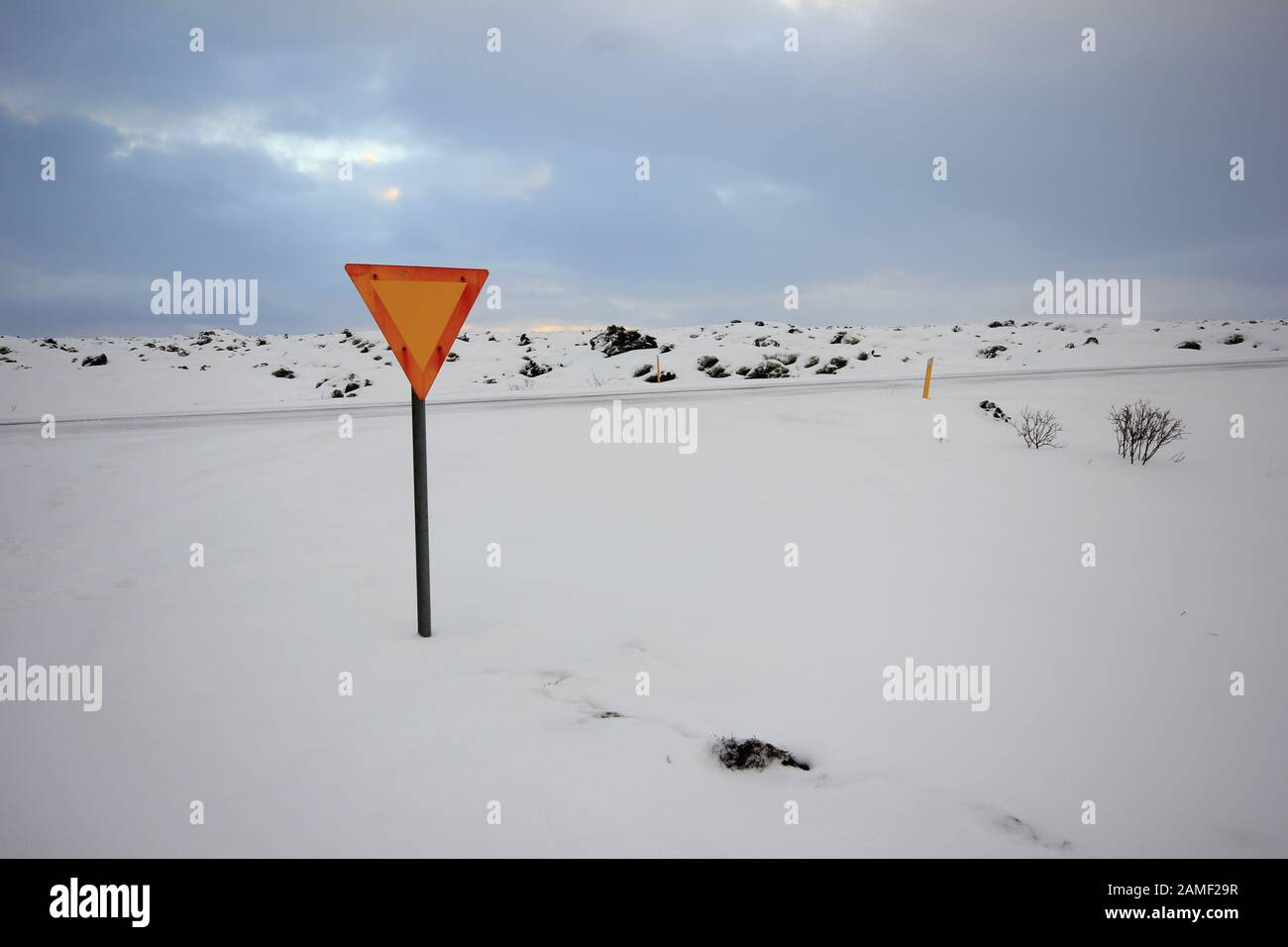 Solo upside down triangle standing in the snow in Iceland Stock Photo ...