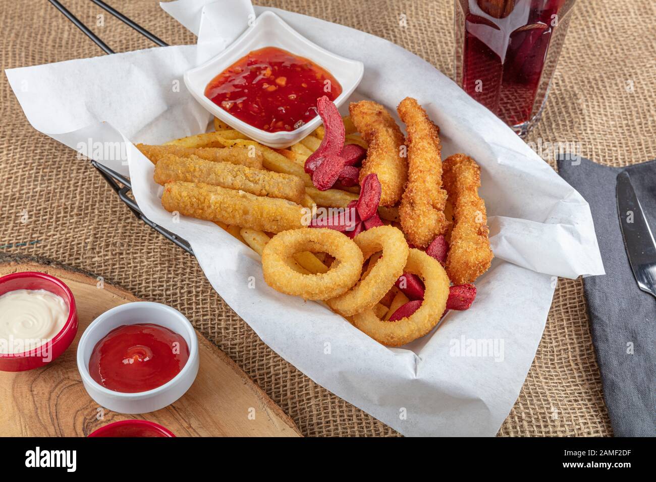 Snack platter - tasty crunchy onion ring, french fries, sausage, fried ...