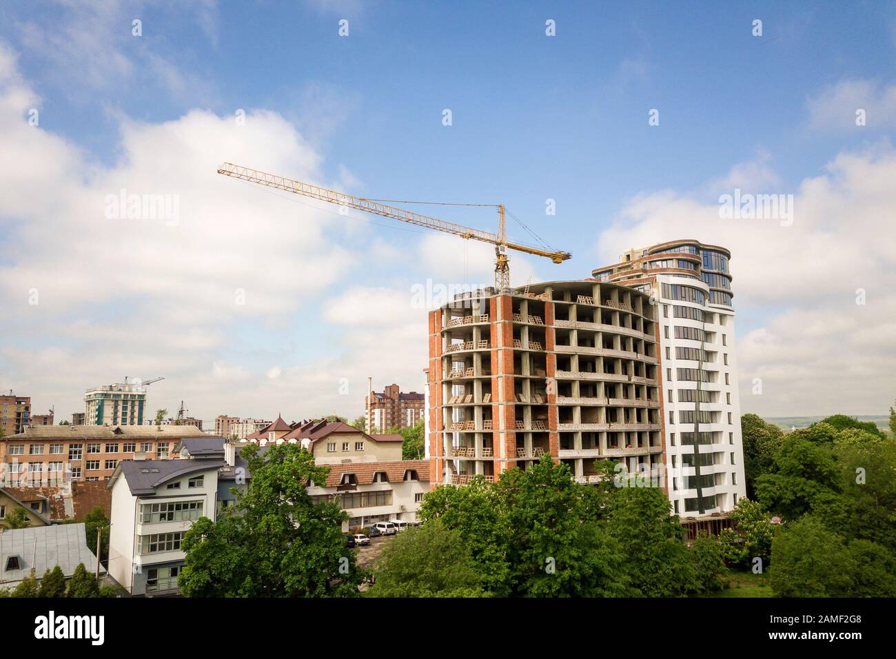 Apartment or office tall building unfinished under construction among ...