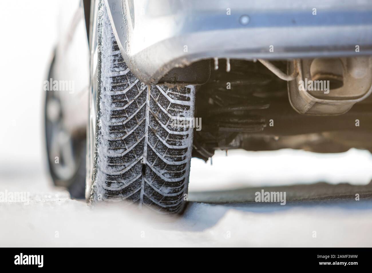 Close-up of car wheels rubber tire in deep snow. Transportation and ...