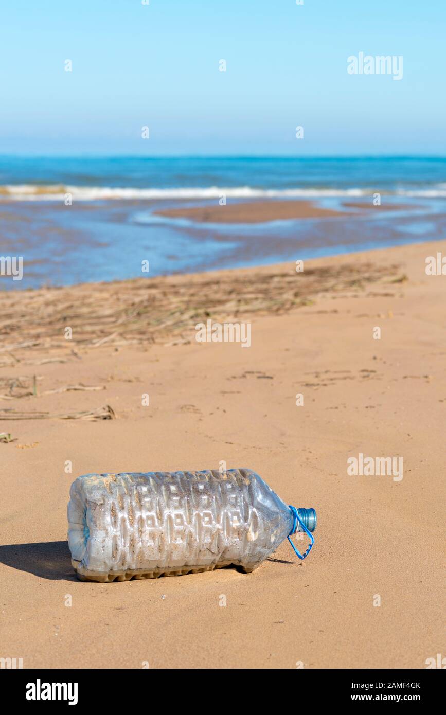Plastic trashes on the beautiful sandy beach Stock Photo - Alamy