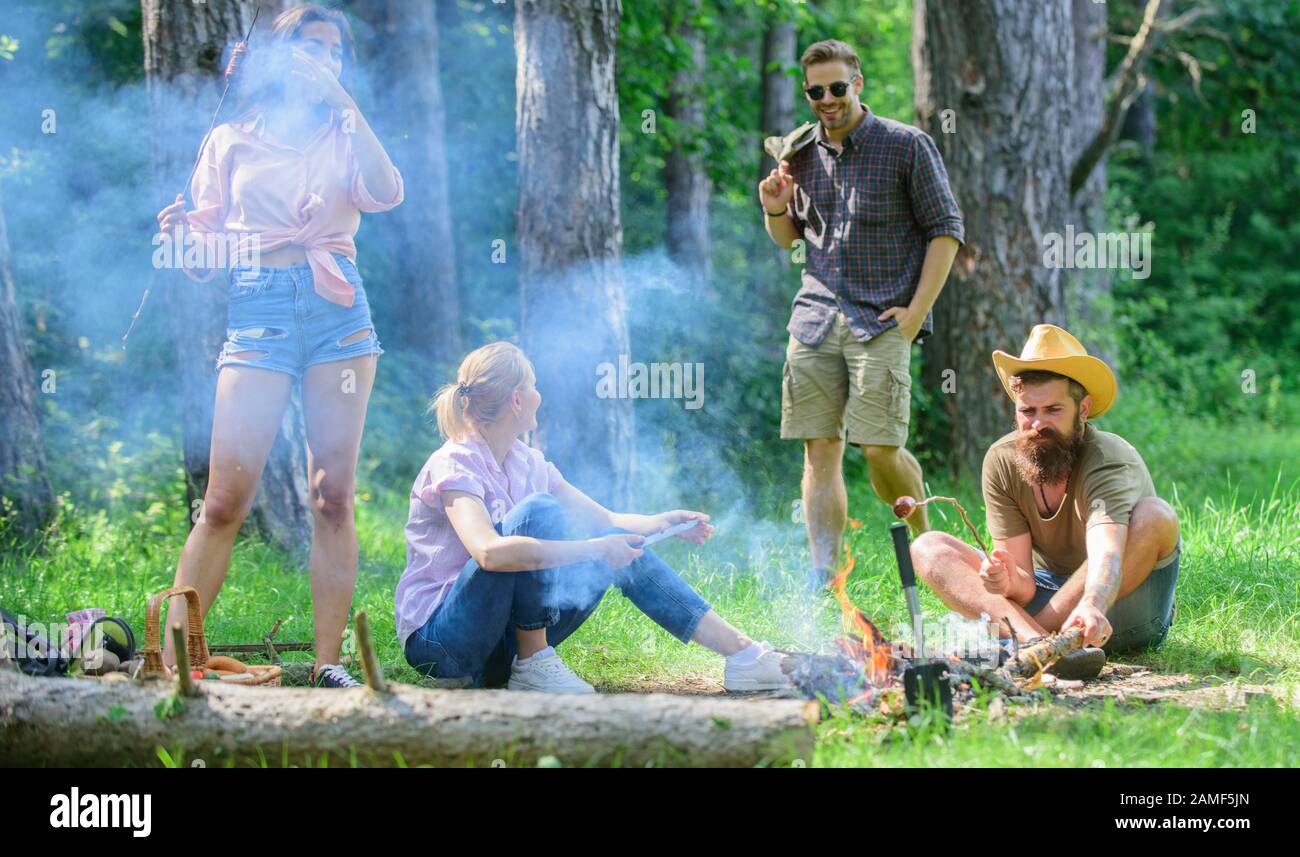 Gathering for great picnic. Friends meeting at meadow to hang out and ...