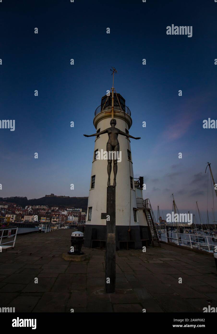 Lighthouse and diving Belle lady statue, Scarborough Stock Photo - Alamy