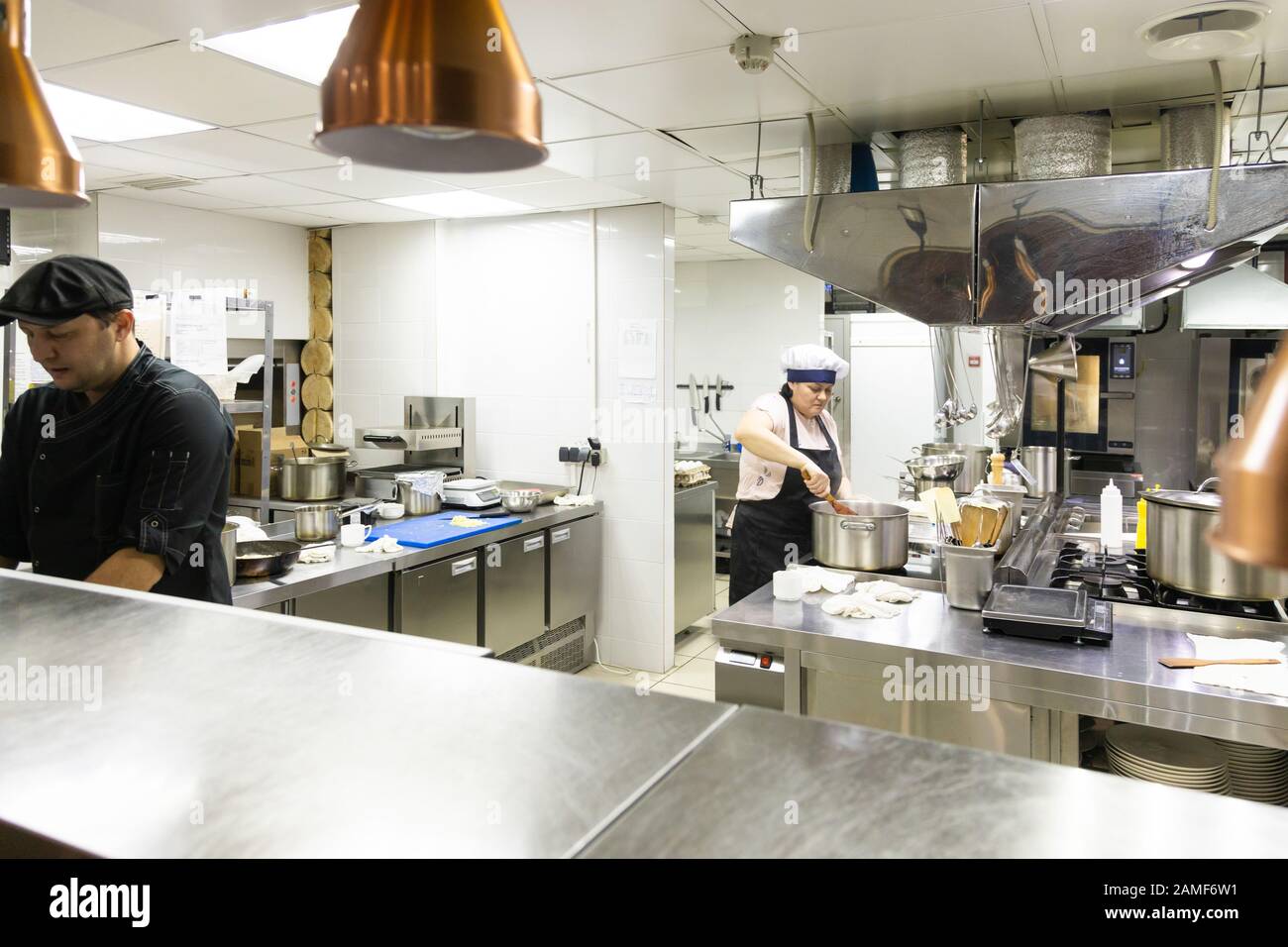 Chef prepares dishes in kitchen hi-res stock photography and images - Alamy