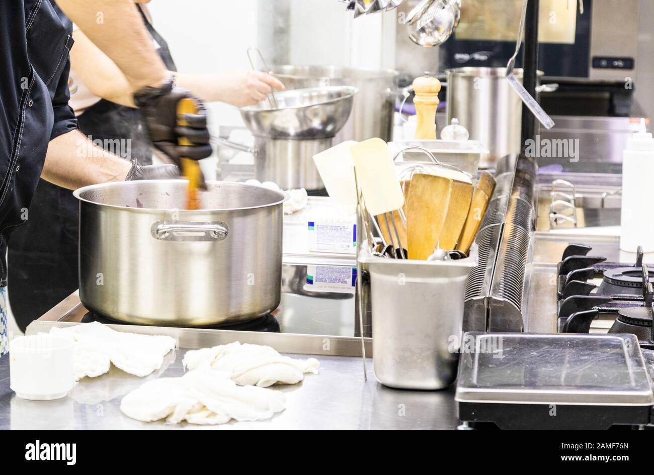 Chef prepares dishes in kitchen hi-res stock photography and images - Alamy