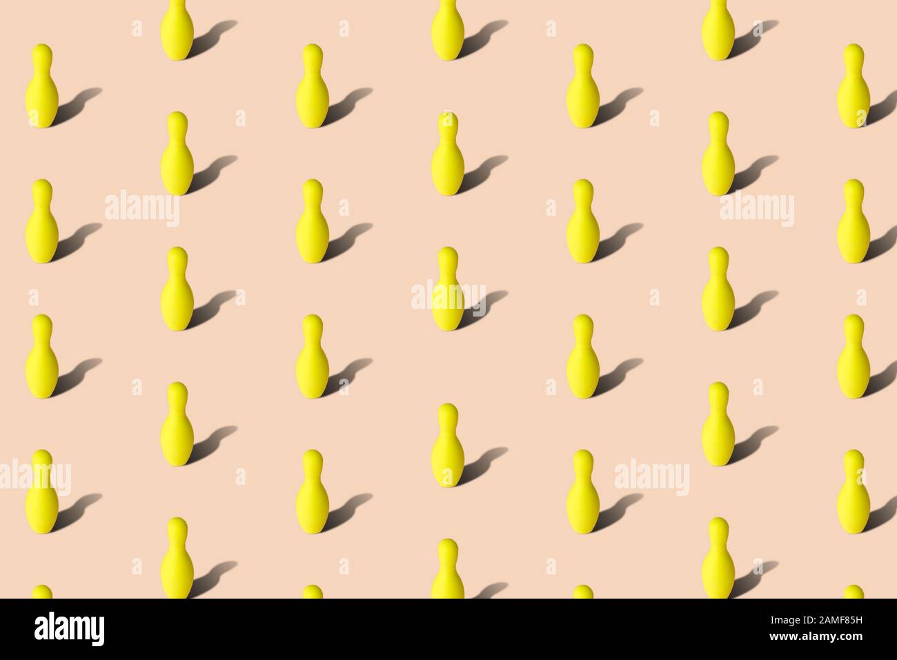 Yellow bowling pins on pastel background sport abstract Stock Photo - Alamy