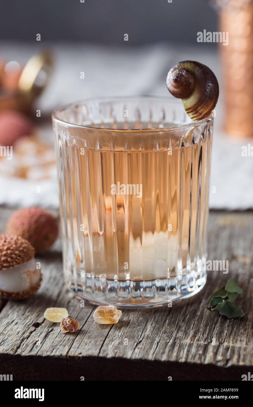 Glass of cold lychee juice on the old wooden table, rustic style Stock ...