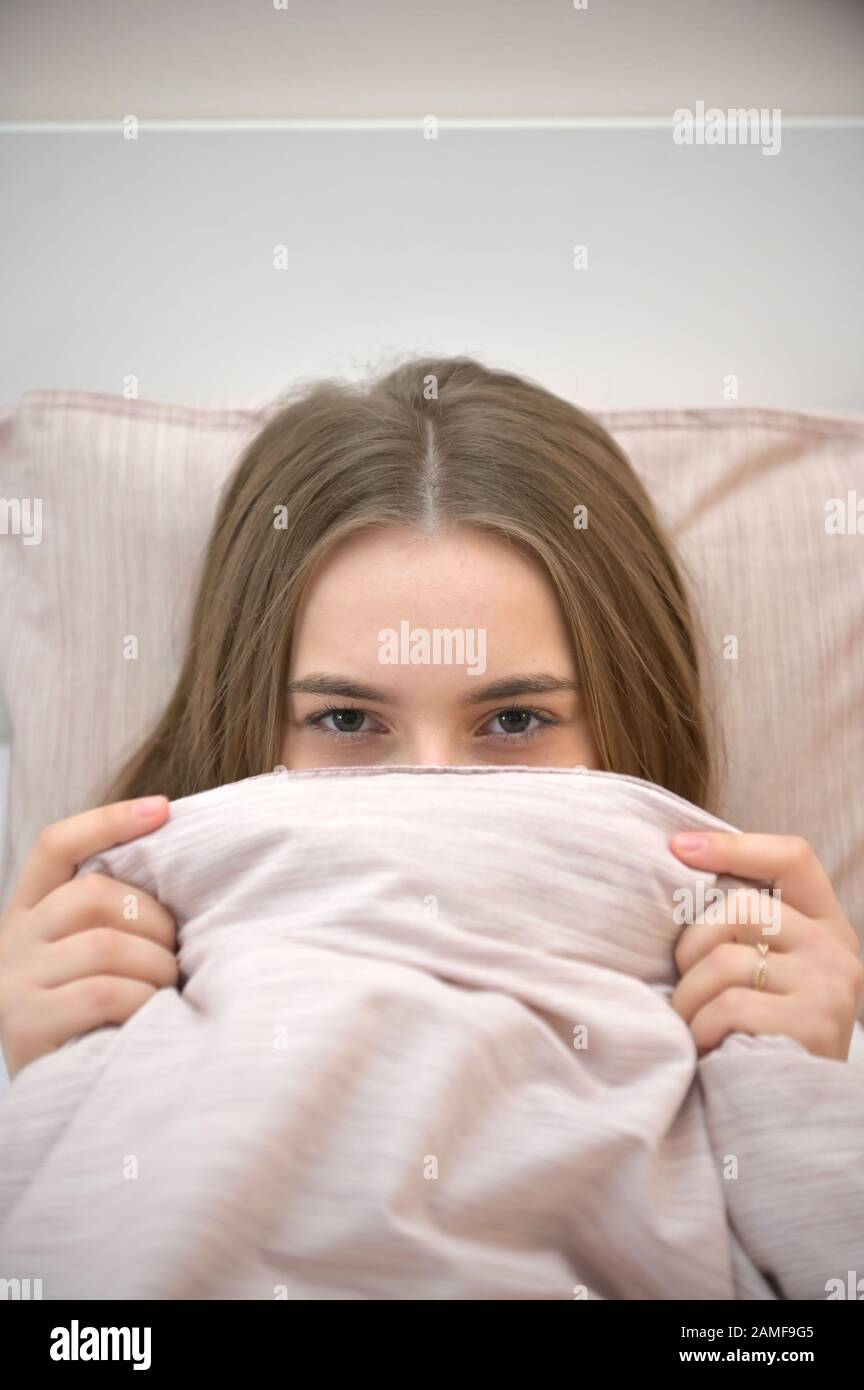 Young woman hides hi-res stock photography and images - Alamy