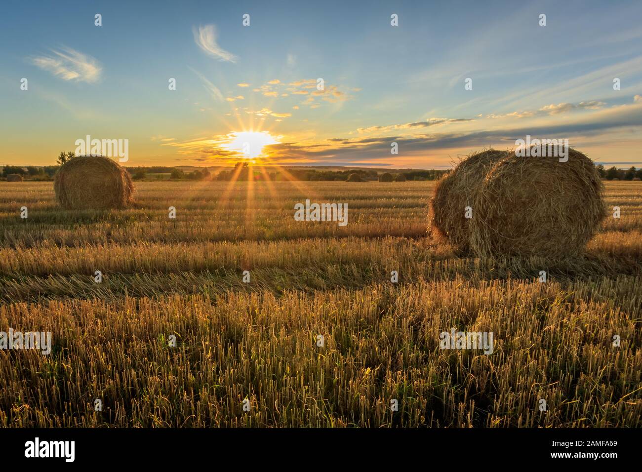 Haystacks on the field in Autumn season. Rural landscape with cloudy ...