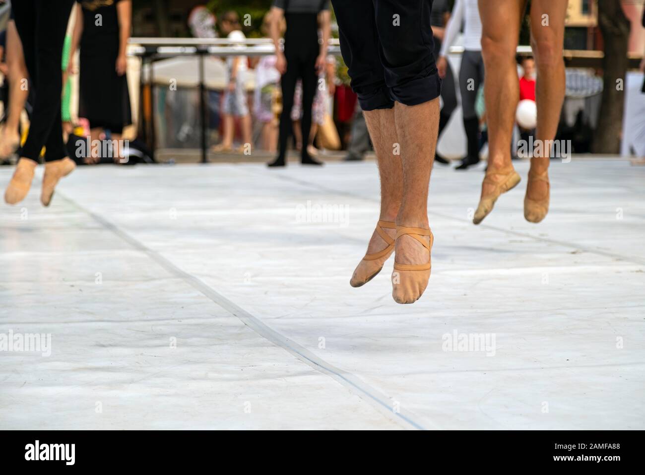 Ballet dancers practicing performance outdoors. Close up of ballerina ...