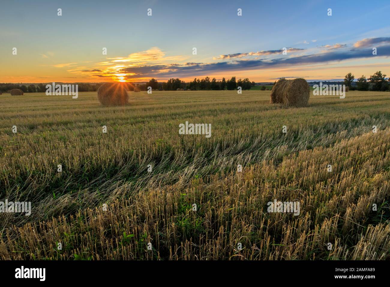 Haystacks on the field in Autumn season. Rural landscape with cloudy ...