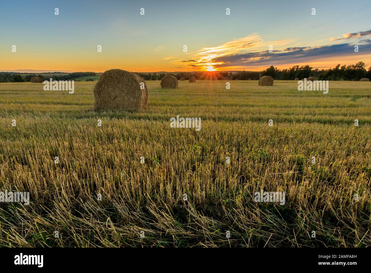 Haystacks on the field in Autumn season. Rural landscape with cloudy ...