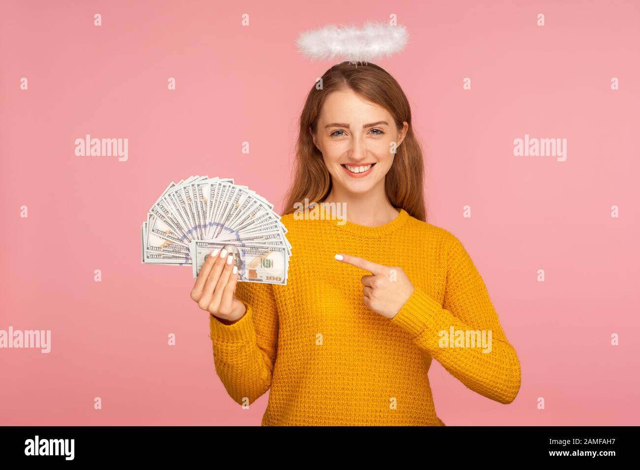 Look at my profit. Portrait of charming angelic ginger girl with halo ...