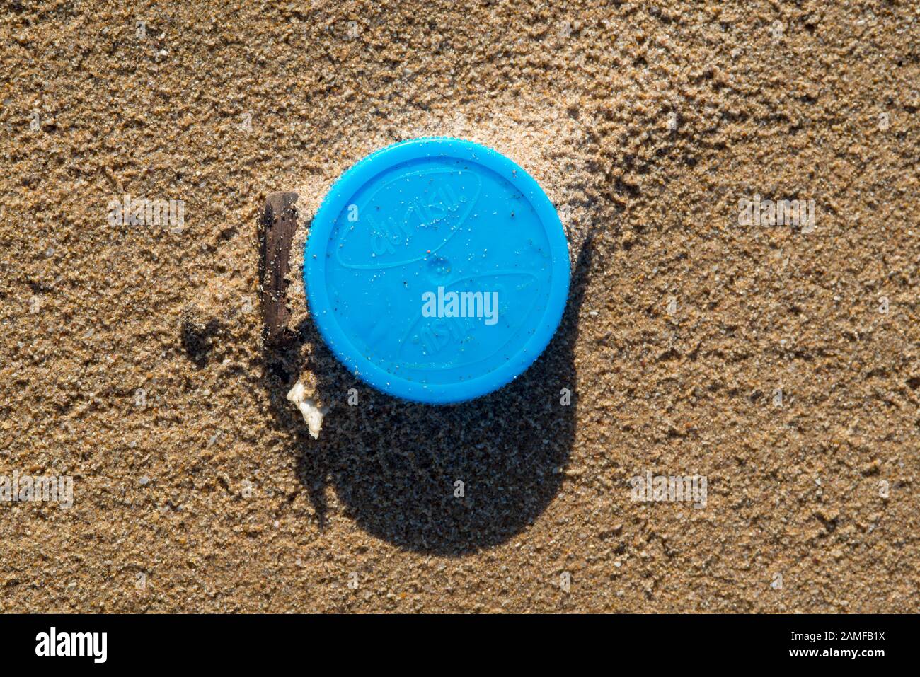 Plastic trashes on the beautiful sandy beach Stock Photo - Alamy