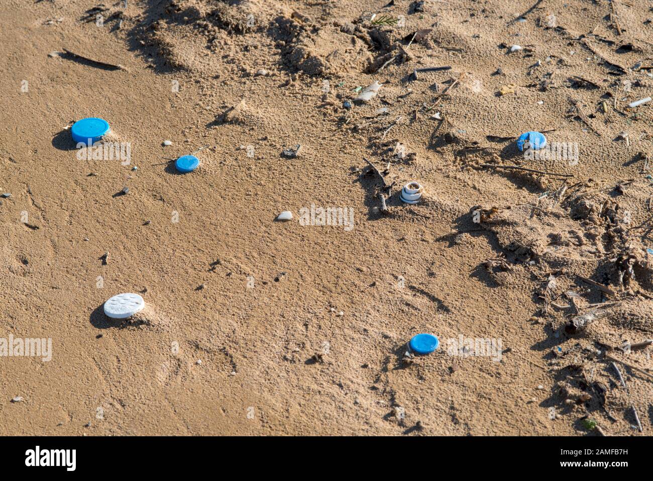 Plastic trashes on the beautiful sandy beach Stock Photo - Alamy