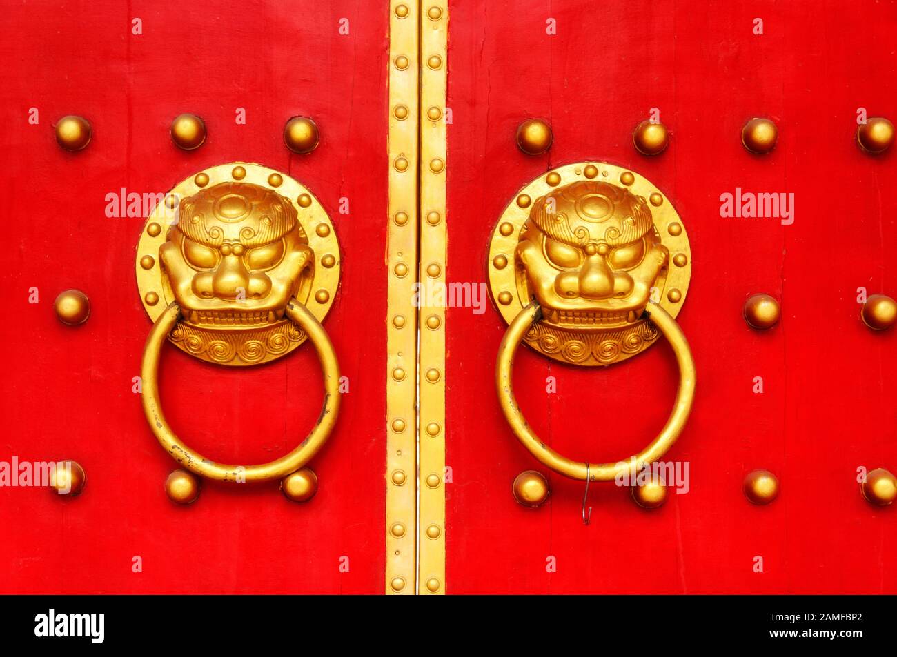 Red doors and lion door knockers at the Jile temple (temple of bliss ...