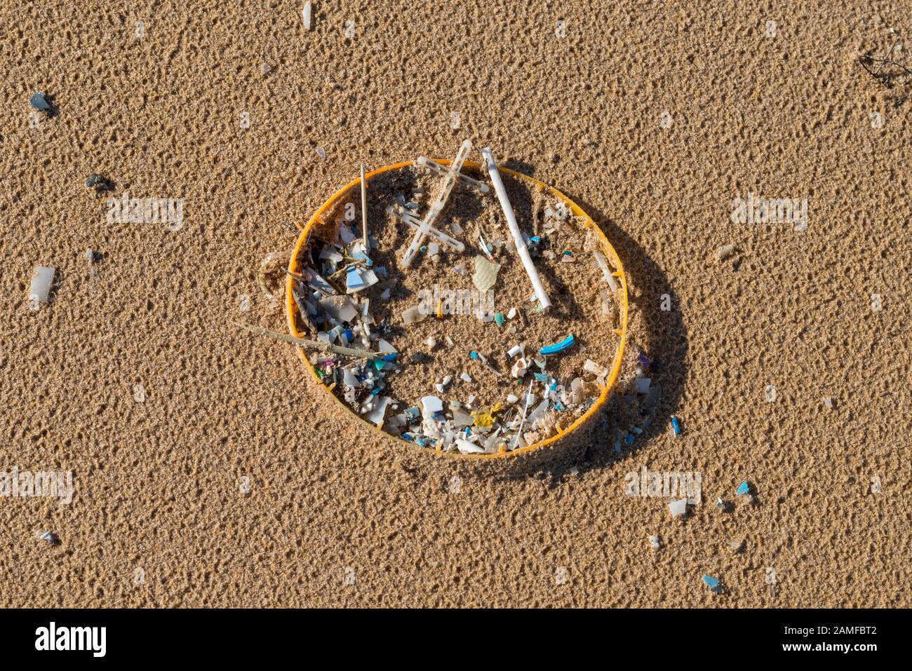 Plastic trashes on the beautiful sandy beach Stock Photo - Alamy