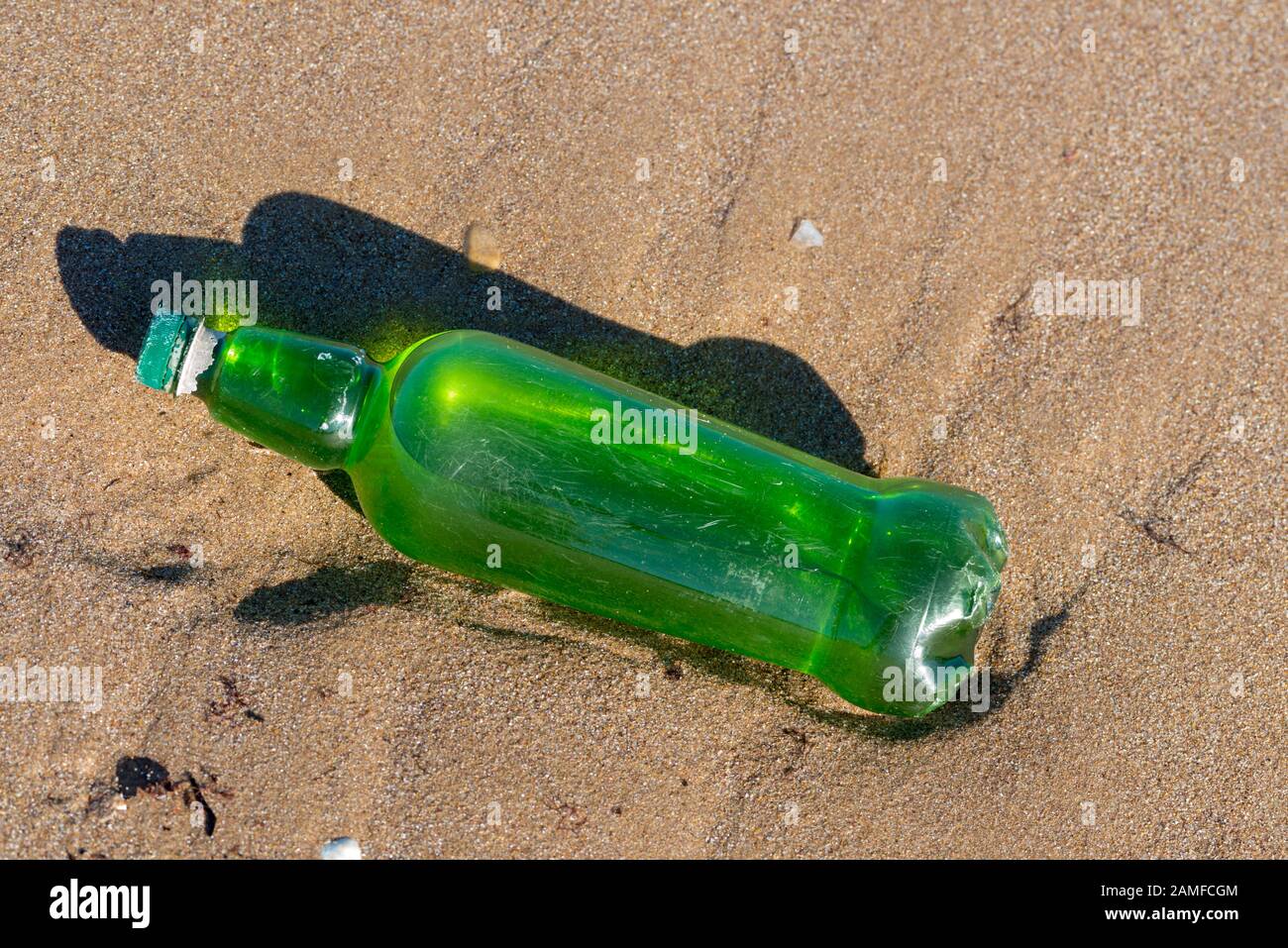 Plastic trashes on the beautiful sandy beach Stock Photo - Alamy