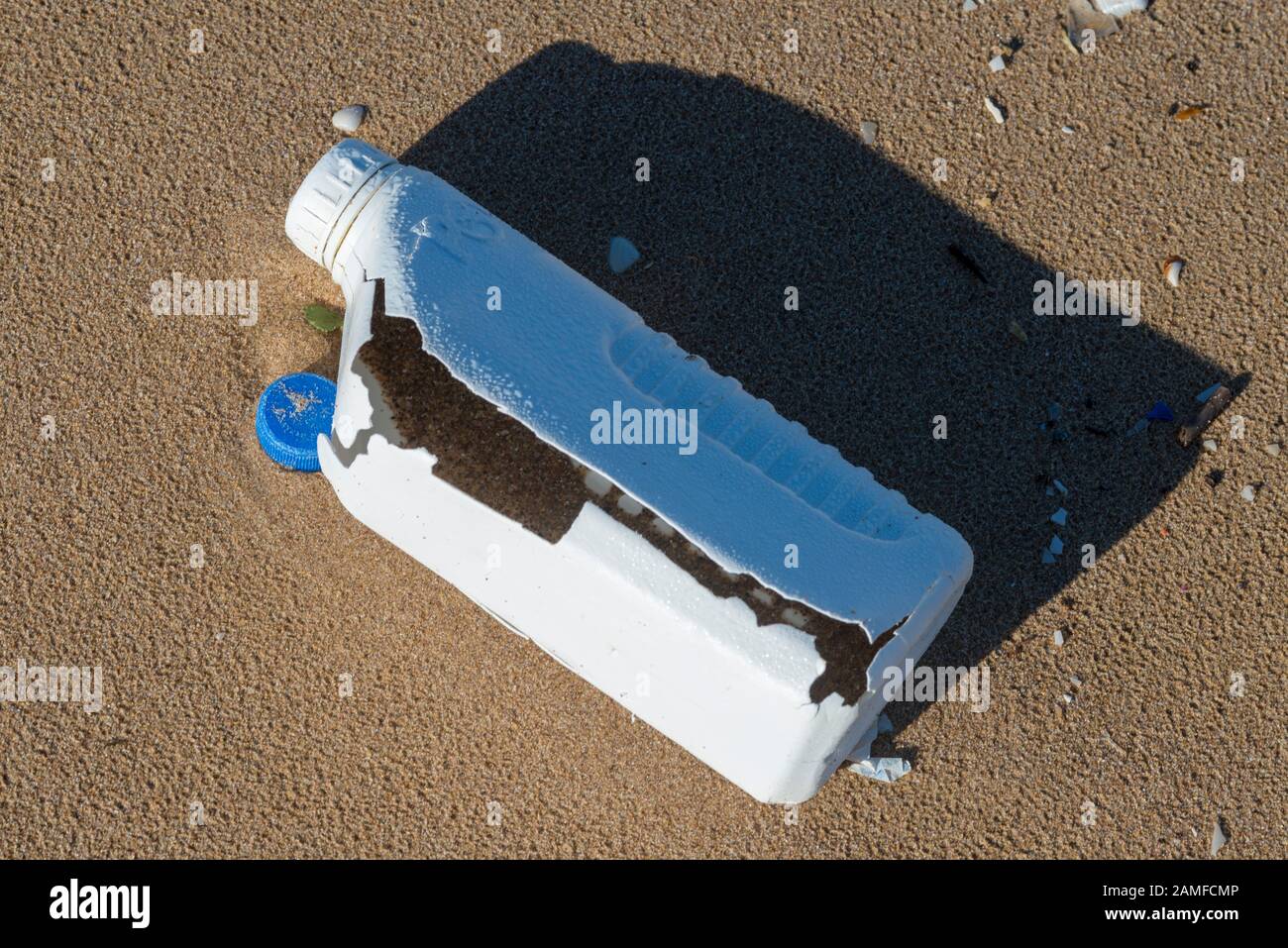 Plastic trashes on the beautiful sandy beach Stock Photo - Alamy