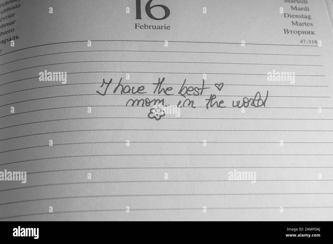 Mother`s day concept. Writing text for mother on personal agenda. I ...