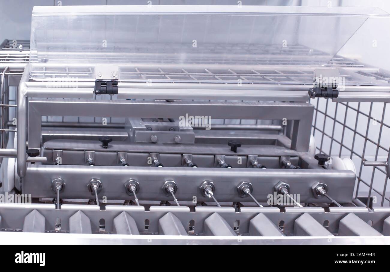 Making and filling custard cakes with cream on a modern automatic line ...