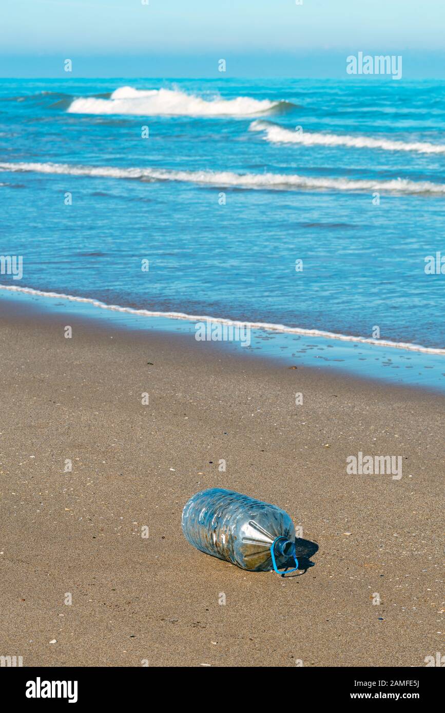 Plastic trashes on the beautiful sandy beach Stock Photo - Alamy