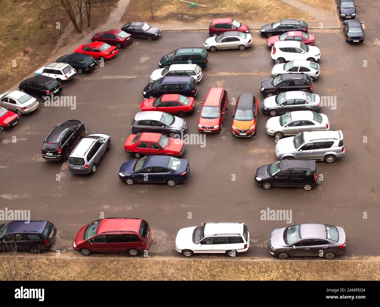 BOBRUISK, BELARUS 10.03.2019: Cars parked in a chaotic manner in the ...