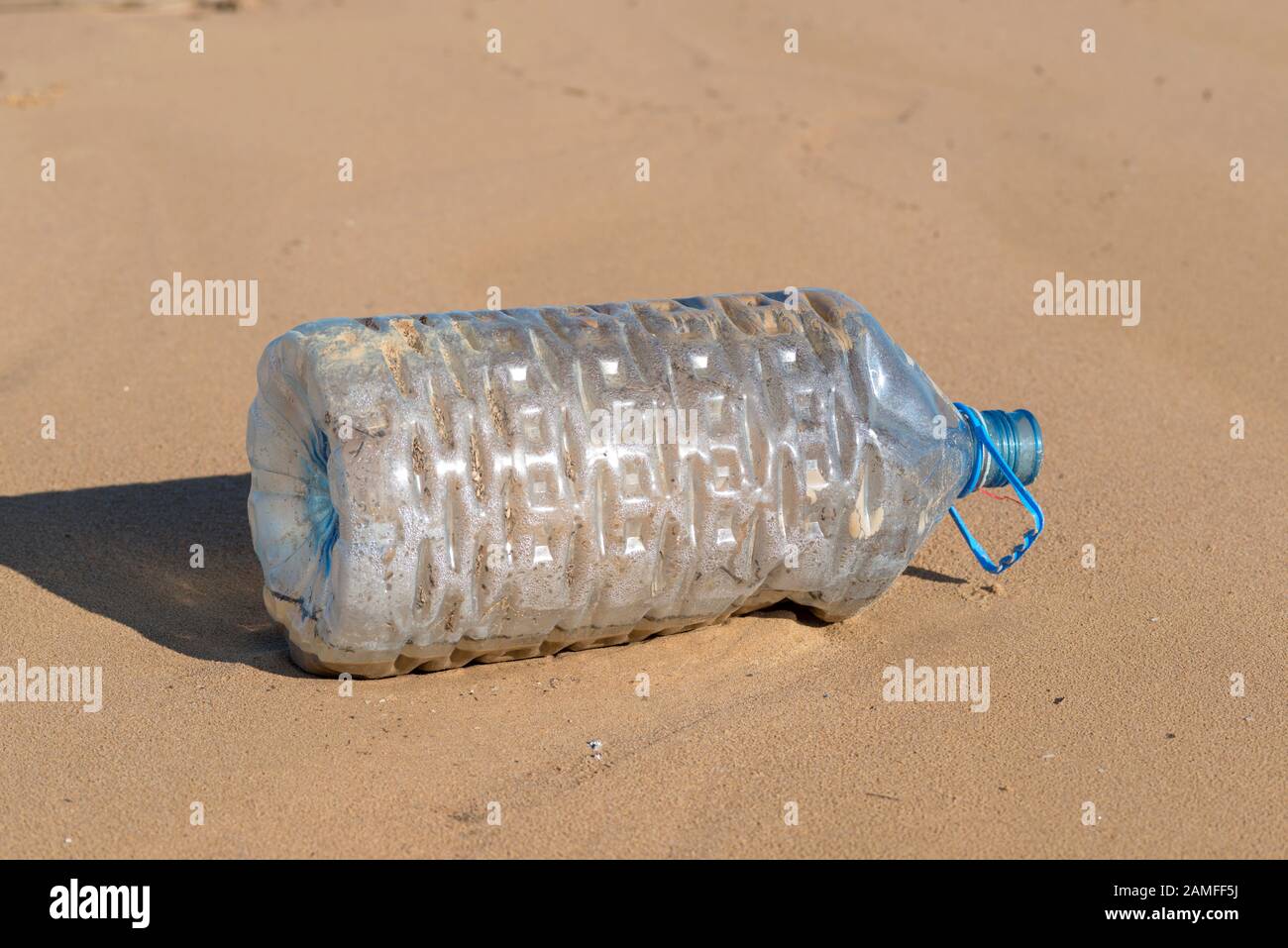Plastic trashes on the beautiful sandy beach Stock Photo - Alamy