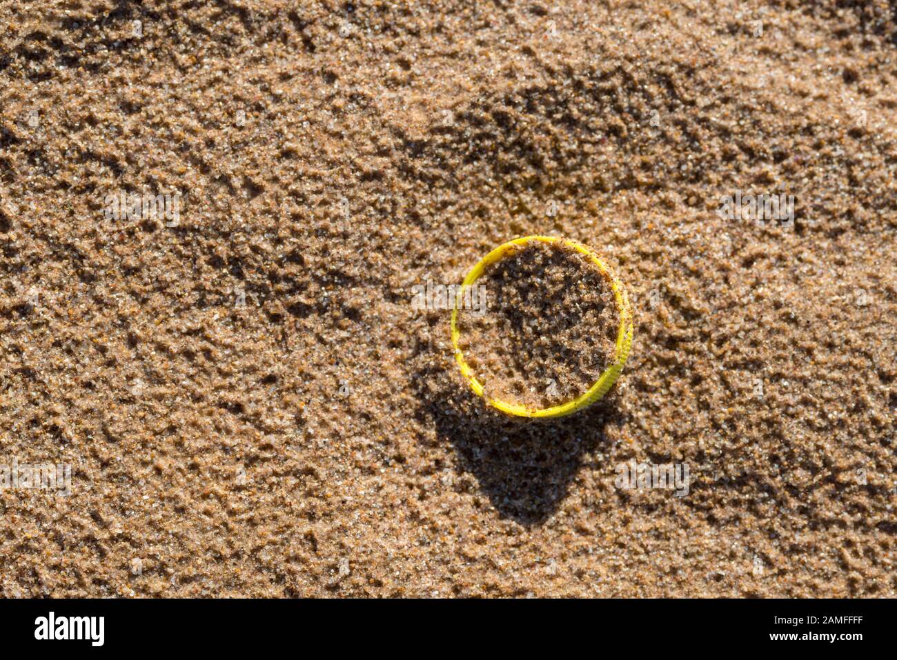 Plastic trashes on the beautiful sandy beach Stock Photo - Alamy