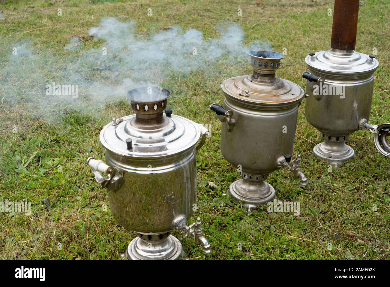 Samovars in a clearing in the process of heating water. Samovar is a ...