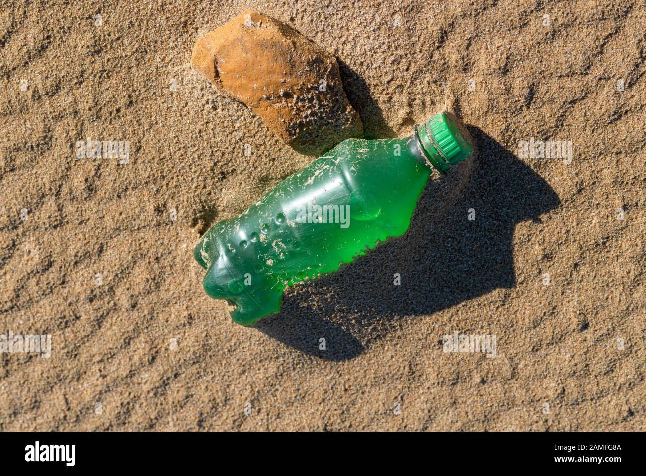 Plastic trashes on the beautiful sandy beach Stock Photo - Alamy