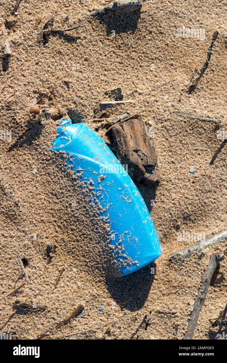 Plastic trashes on the beautiful sandy beach Stock Photo - Alamy