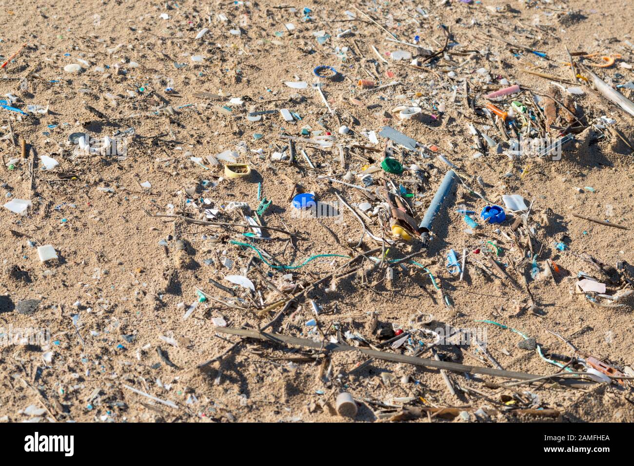 Plastic trashes on the beautiful sandy beach Stock Photo - Alamy