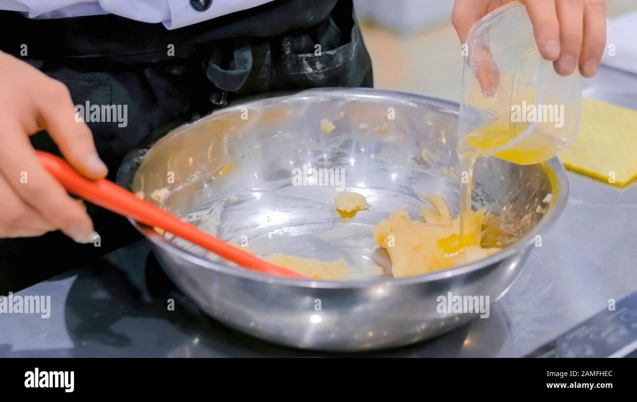 Process of preparing dough in bowl Stock Photo - Alamy