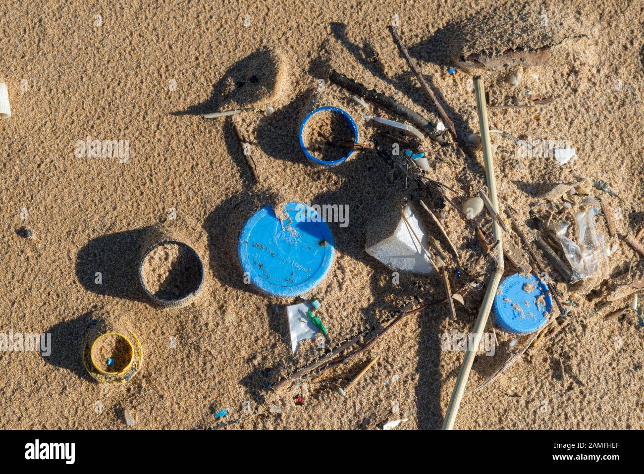 Plastic trashes on the beautiful sandy beach Stock Photo - Alamy