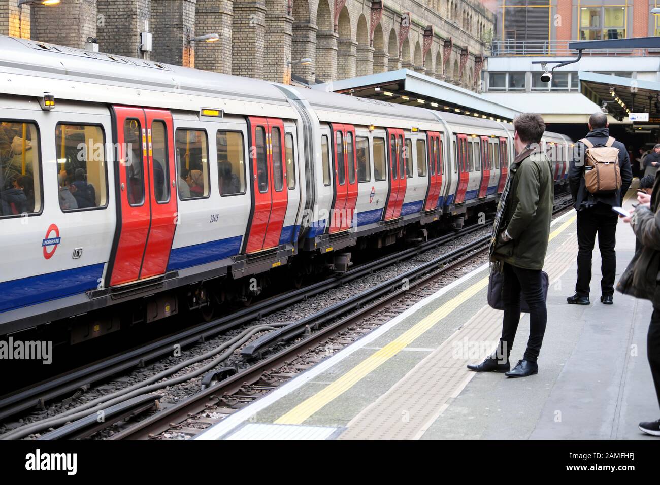 Barbican Station underground tube station train and man person commuter ...