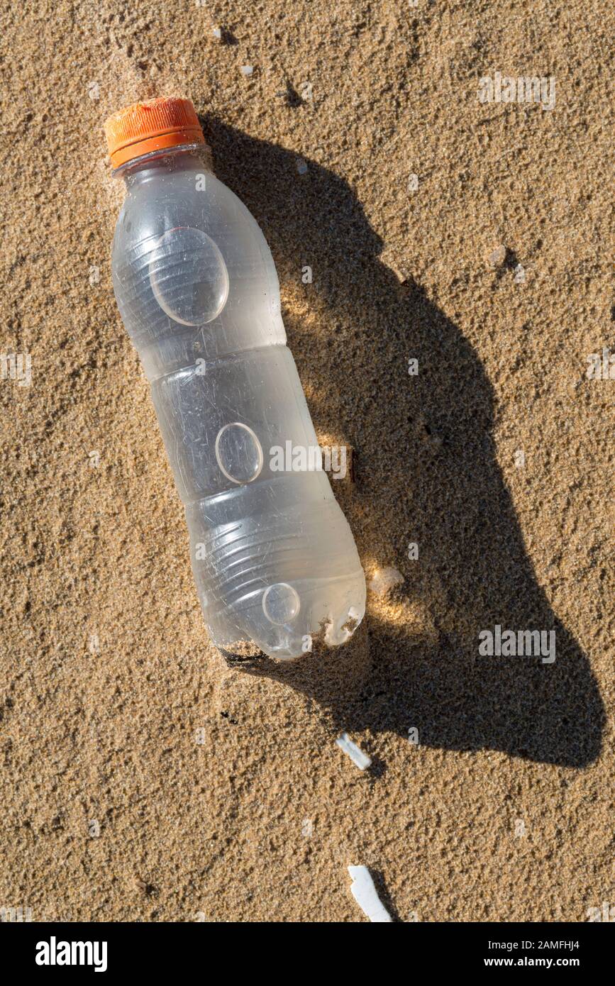 Plastic trashes on the beautiful sandy beach Stock Photo - Alamy