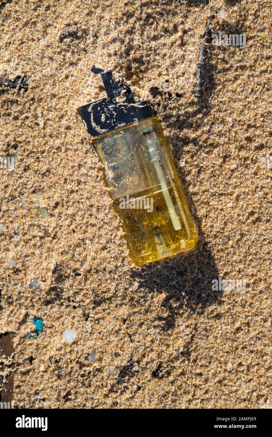 Plastic trashes on the beautiful sandy beach Stock Photo - Alamy