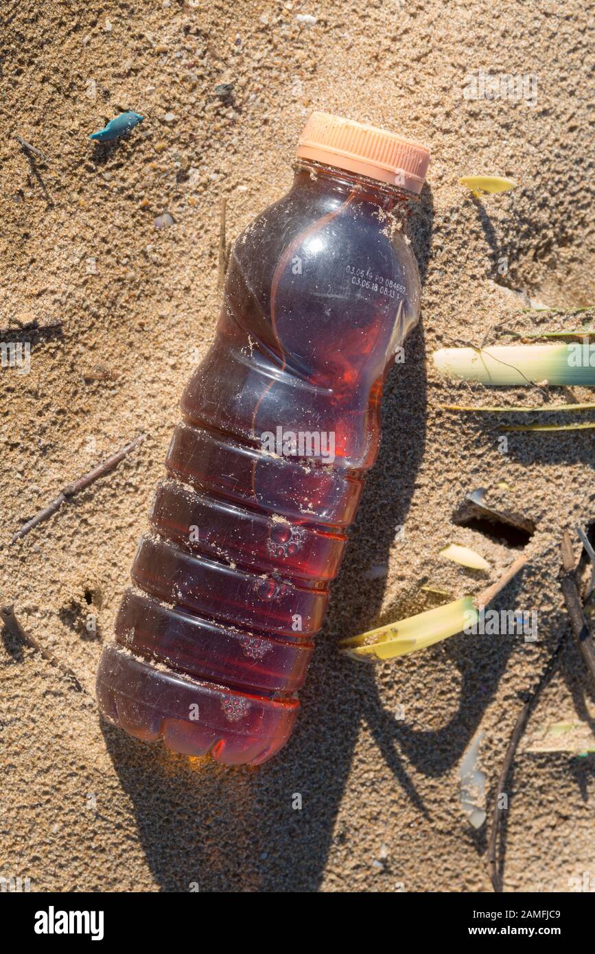Plastic trashes on the beautiful sandy beach Stock Photo - Alamy