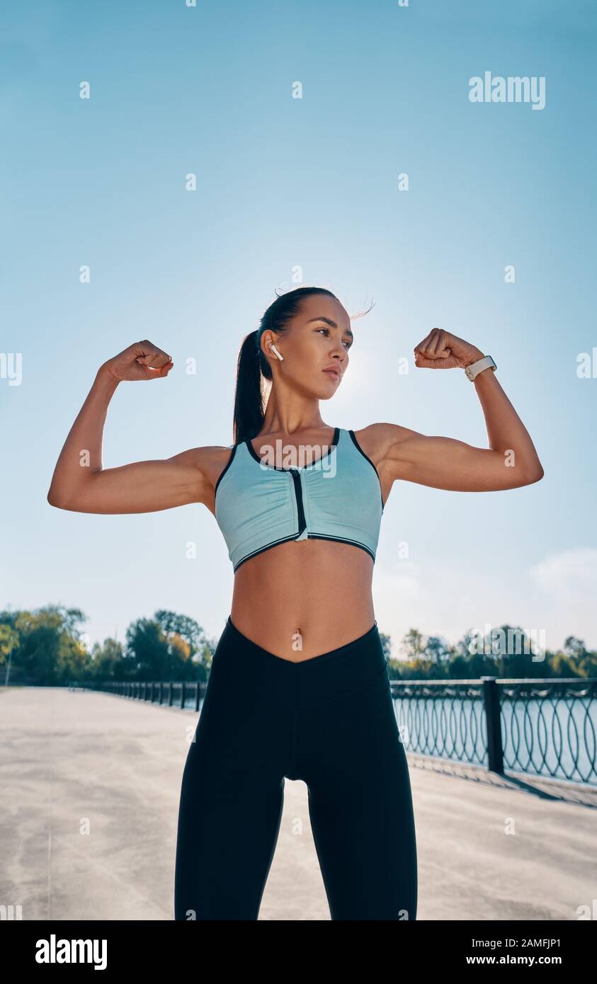 Girl flex muscles hi-res stock photography and images - Alamy
