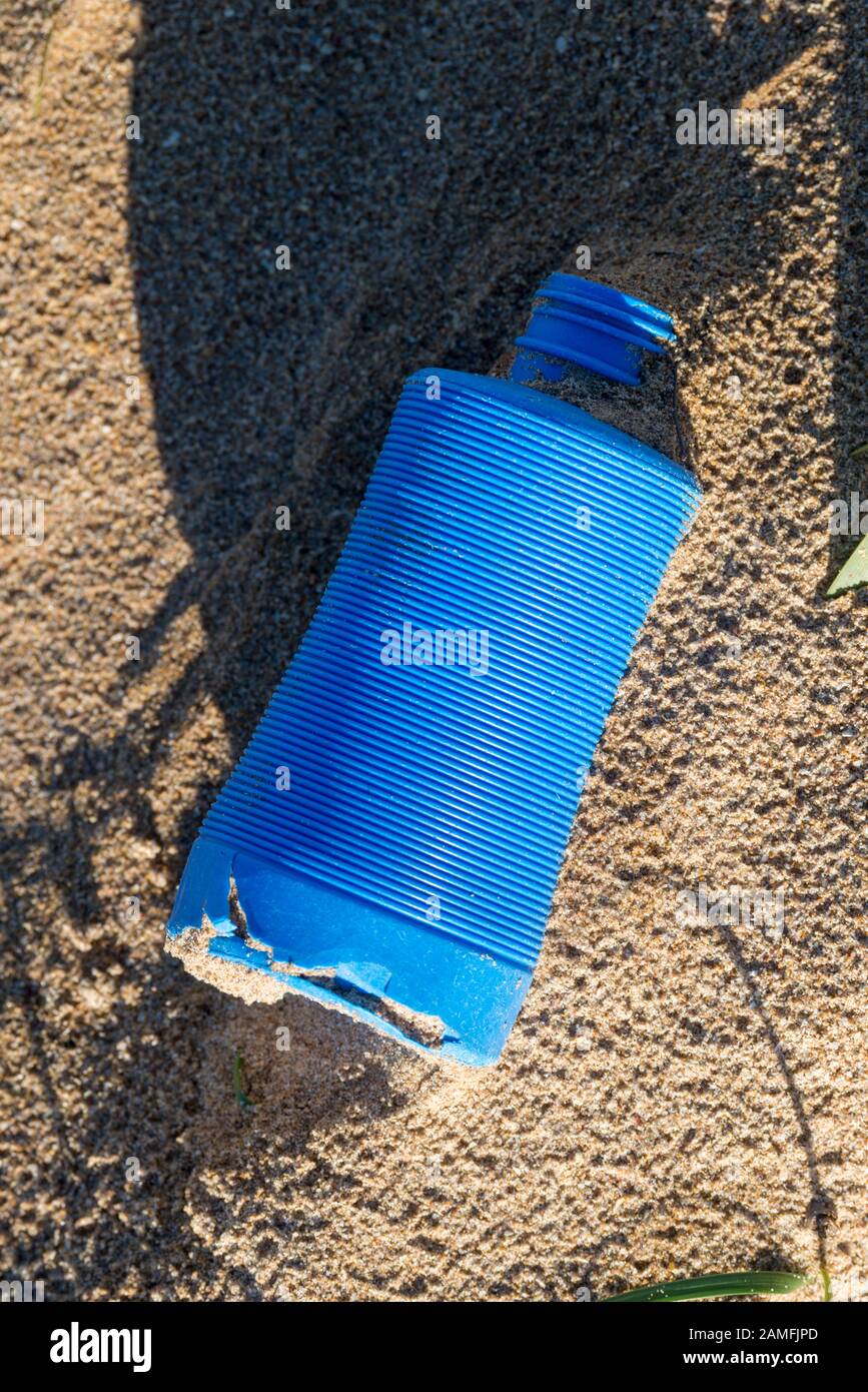 Plastic trashes on the beautiful sandy beach Stock Photo - Alamy
