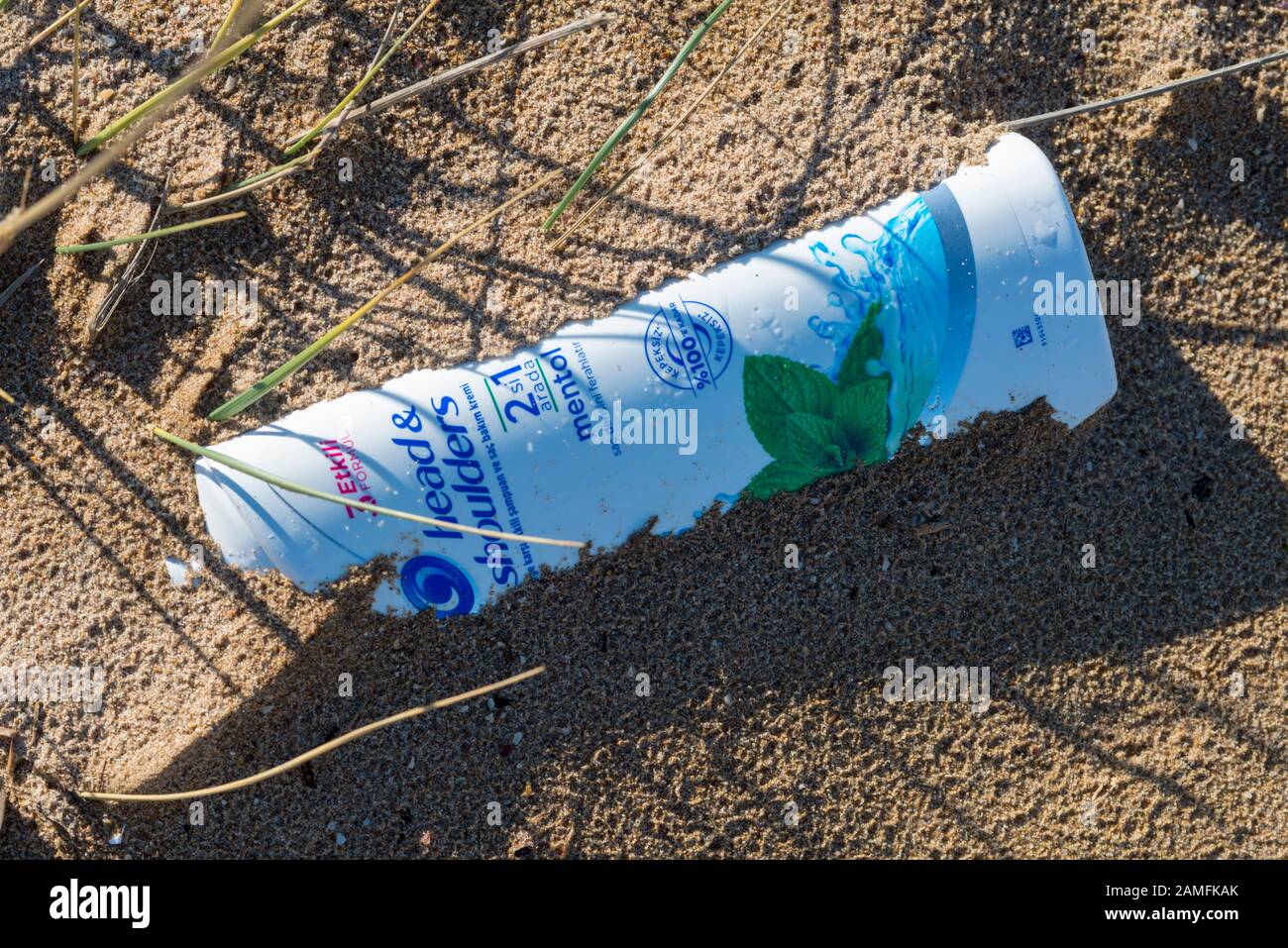 Plastic trashes on the beautiful sandy beach Stock Photo - Alamy