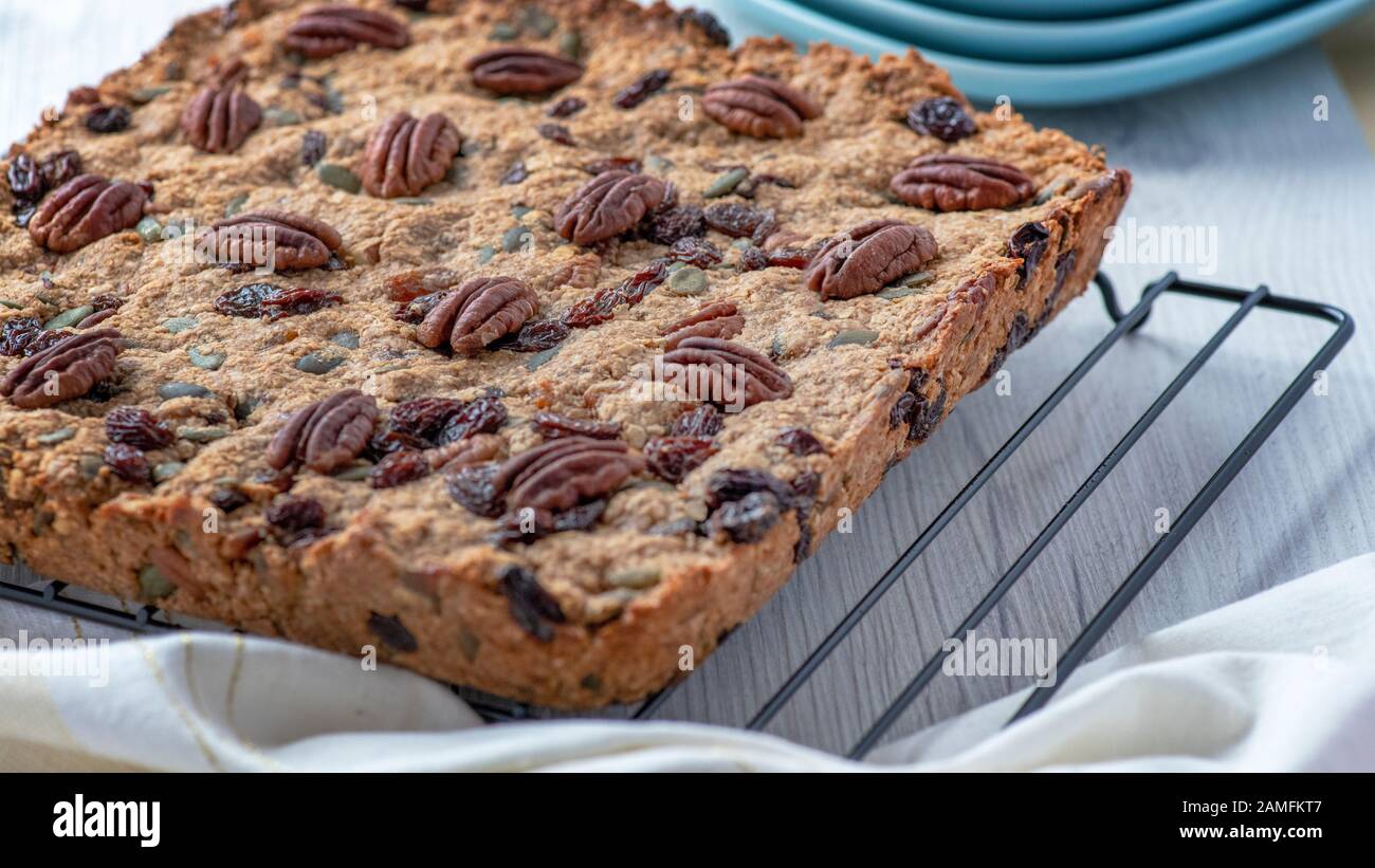 slab of fleshy cooked Plant based vegan cake ,recipe filled with nuts ...