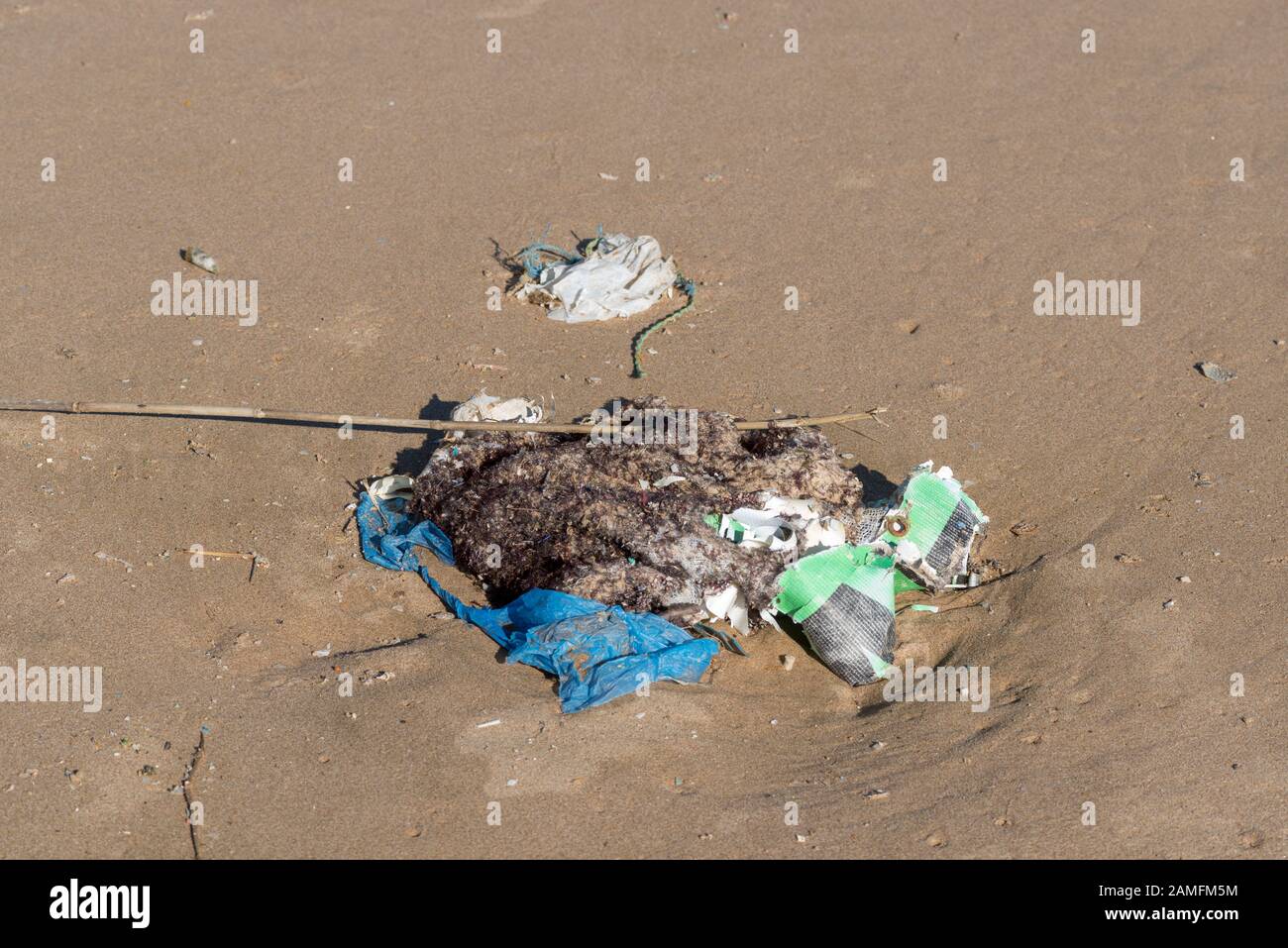 Plastic trashes on the beautiful sandy beach Stock Photo - Alamy