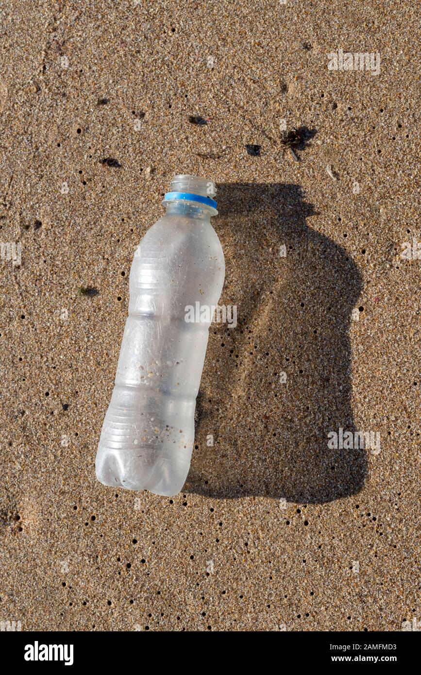 Plastic trashes on the beautiful sandy beach Stock Photo - Alamy