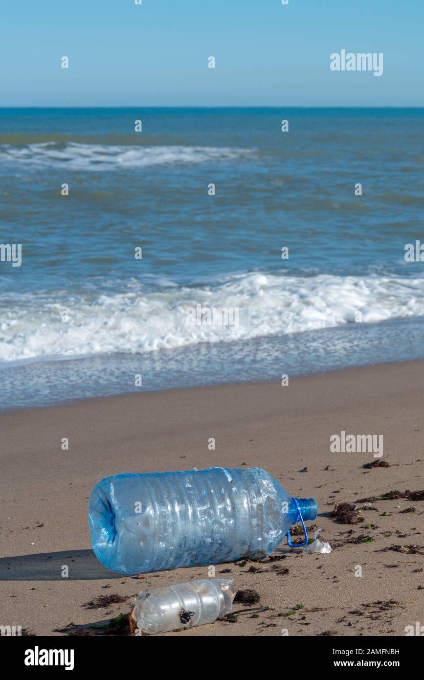 Plastic trashes on the beautiful sandy beach Stock Photo - Alamy