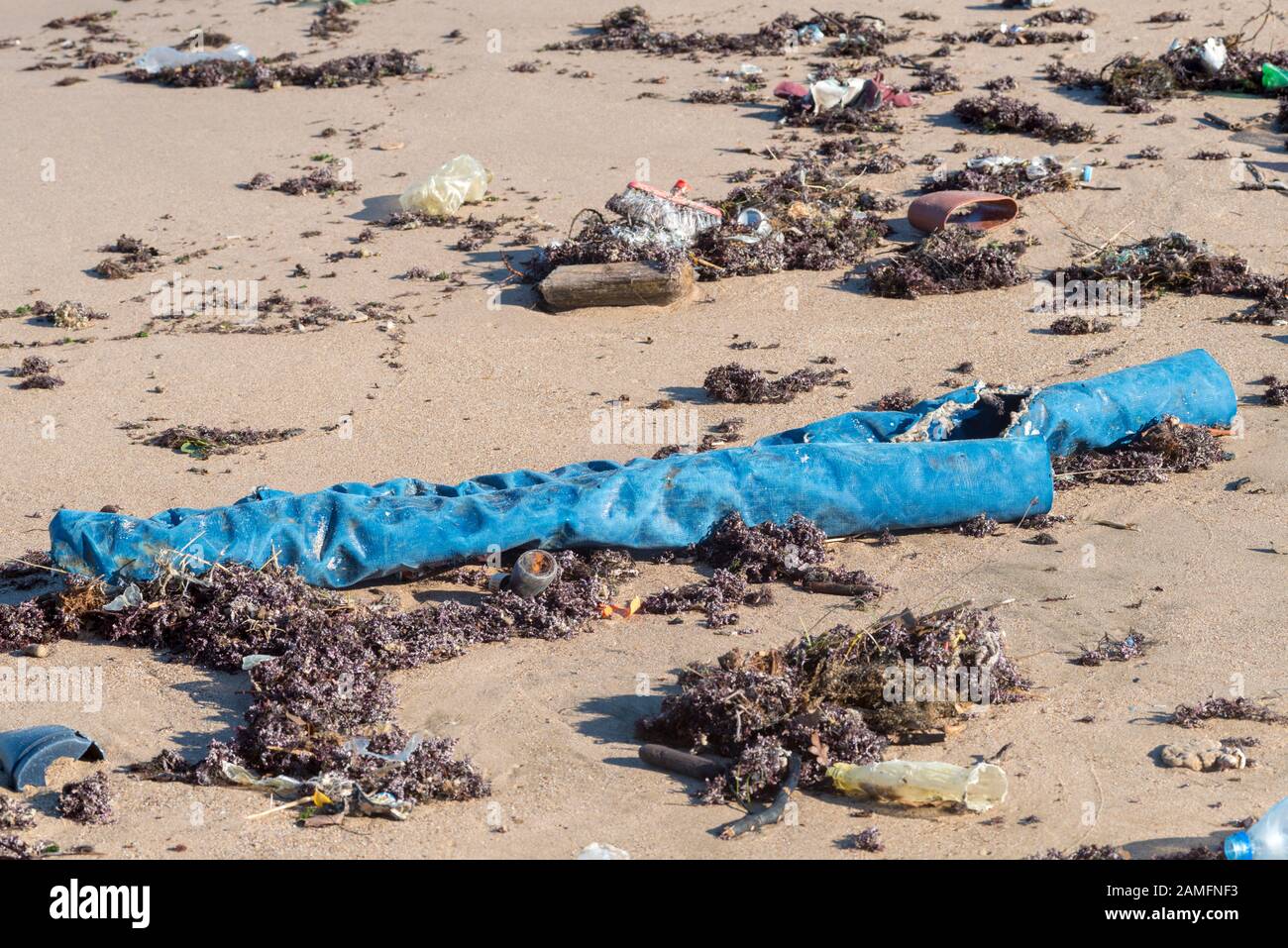 Plastic trashes on the beautiful sandy beach Stock Photo - Alamy