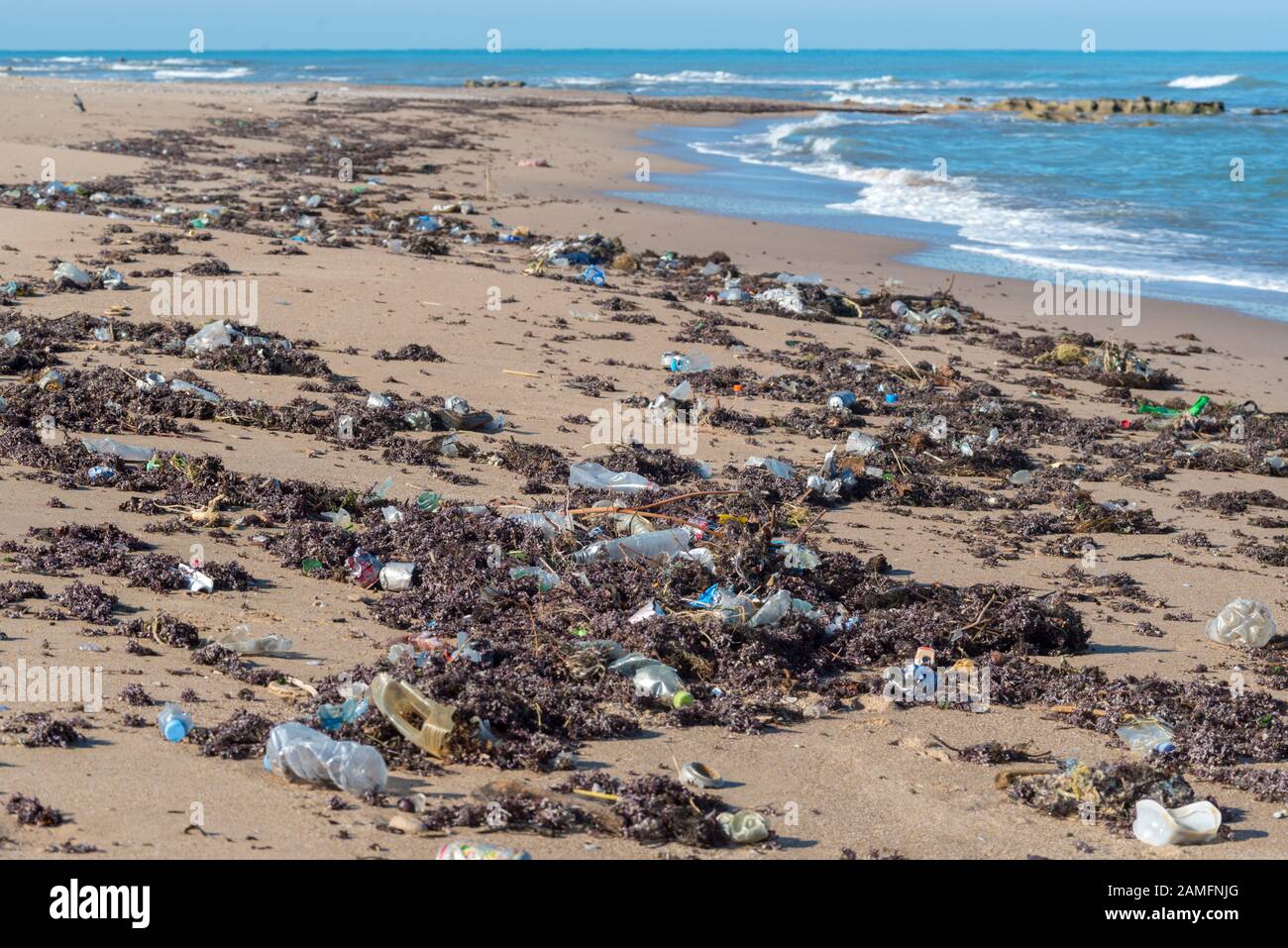 Plastic trashes on the beautiful sandy beach Stock Photo - Alamy