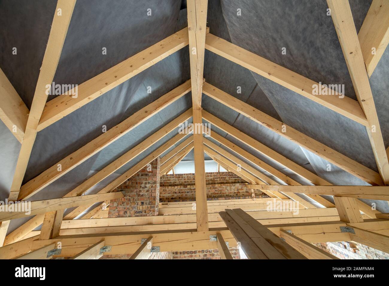 Attic space of a building under construction with wooden beams of a ...